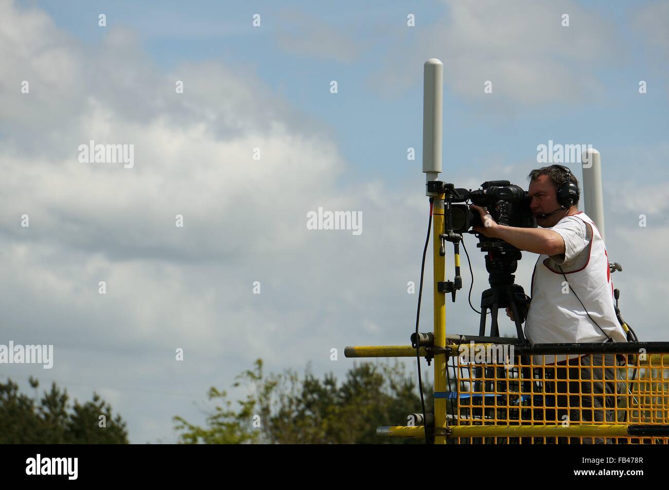 Cameraman at a motor racing event taking place at Castle Combe racing ...