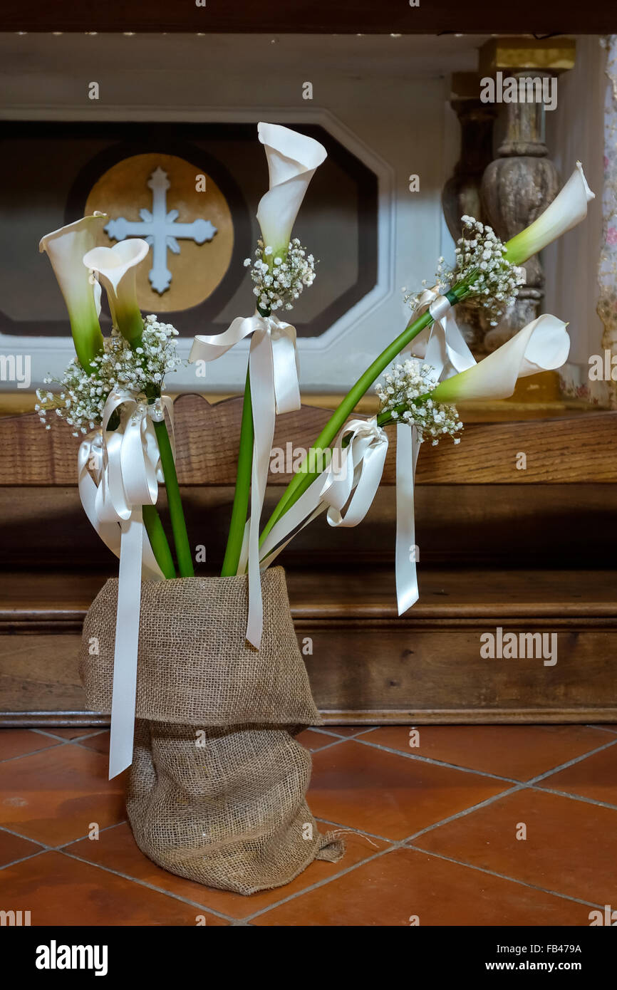 Peace Lilies on display in a church in Pienza Stock Photo - Alamy