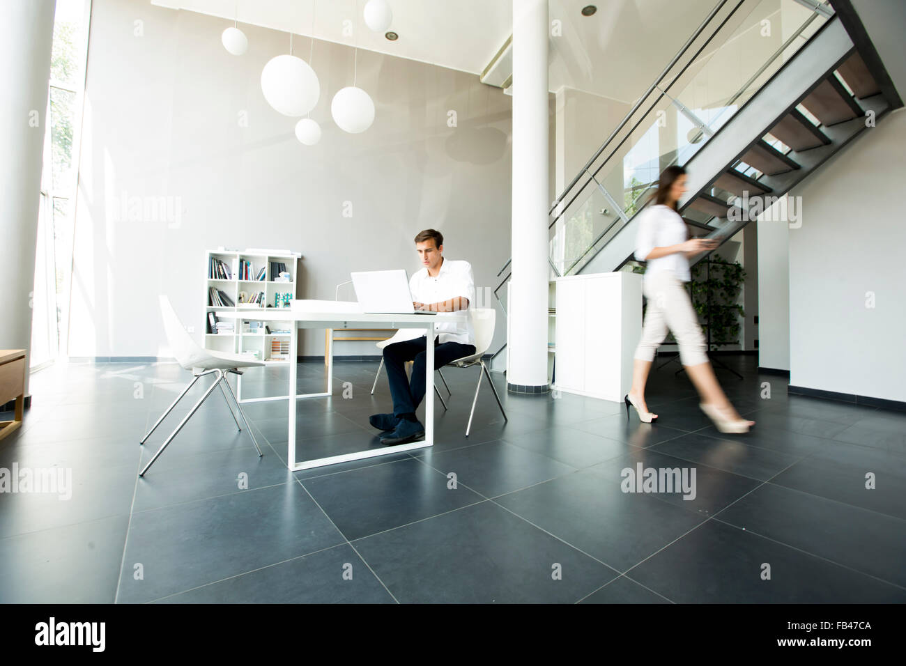 Young people in the office Stock Photo - Alamy