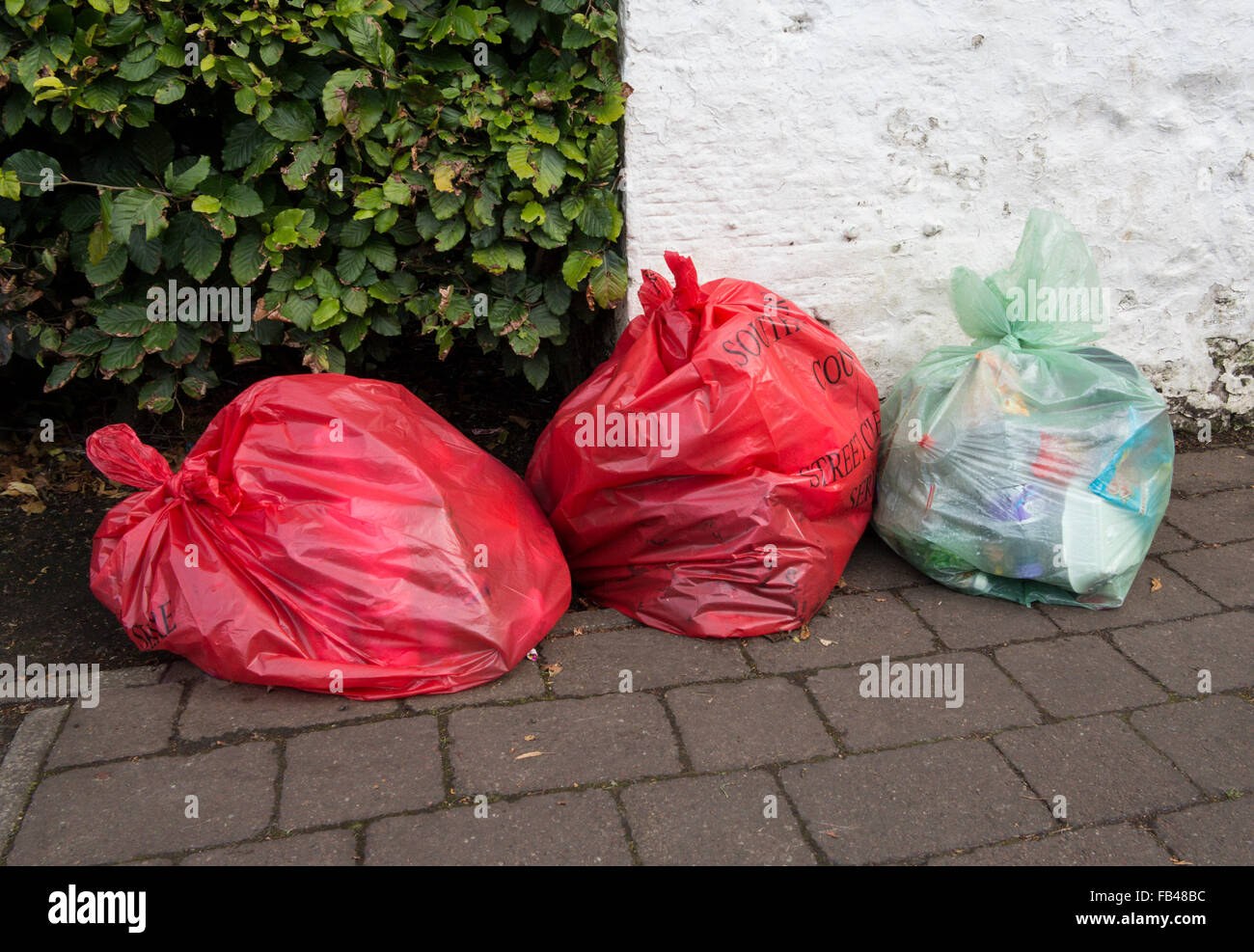 Three rubbish sacks awaiting collection and disposal Stock Photo - Alamy