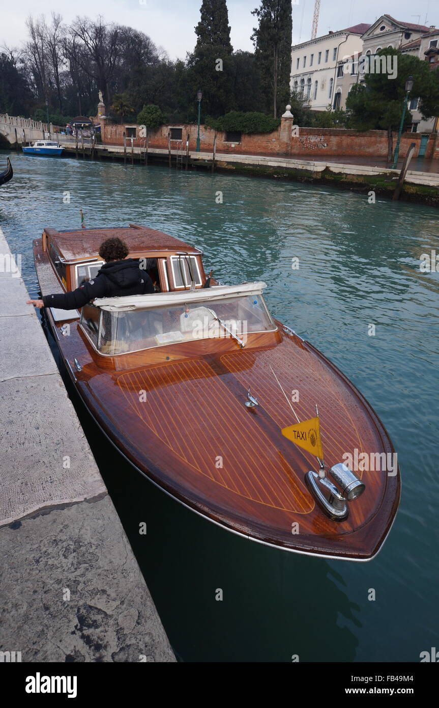 Taxi boat in Venice in Italy ready to board passengers Stock Photo - Alamy
