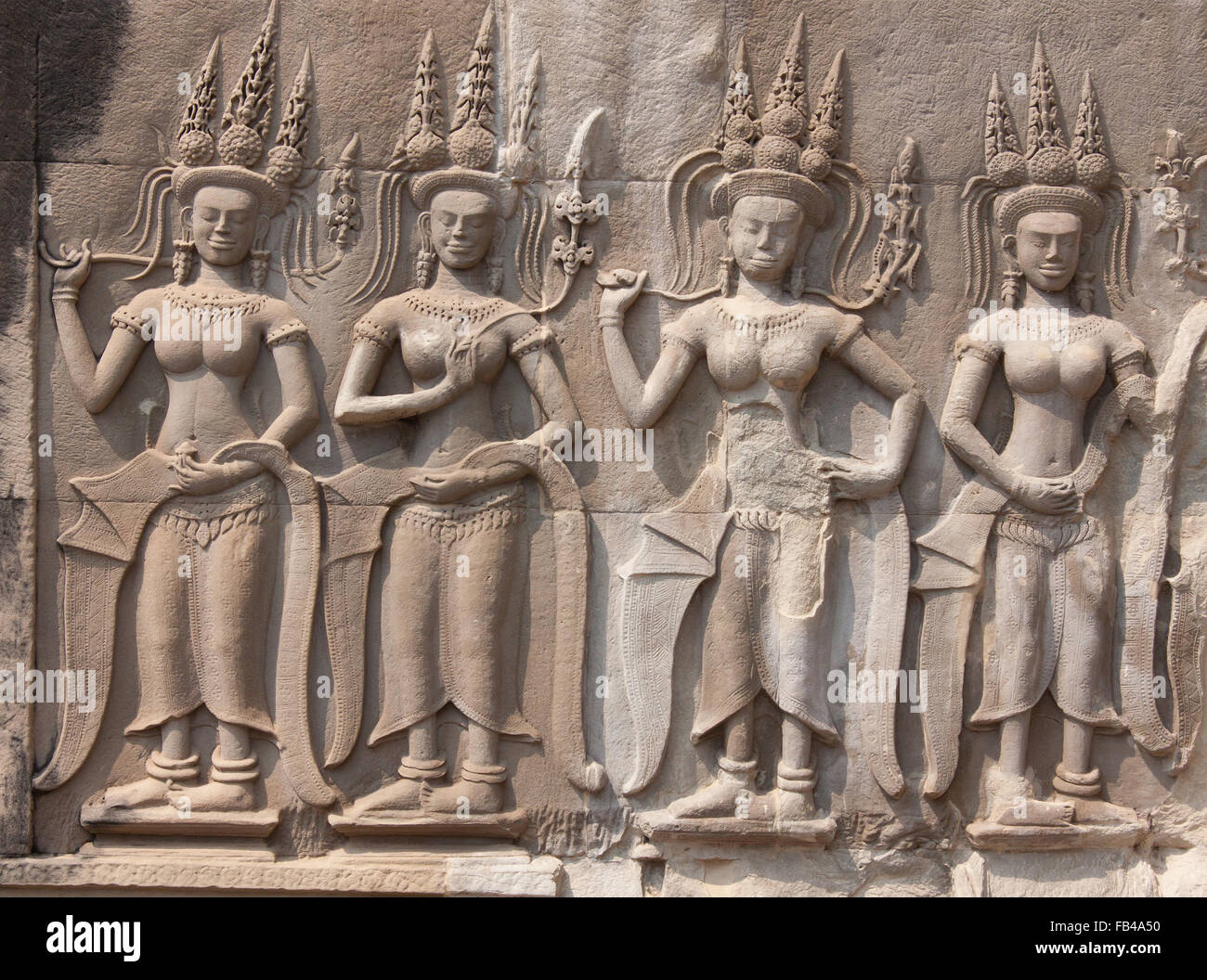 Apsara Dancers Stone Carving all around on the wall at Angkor wat ...