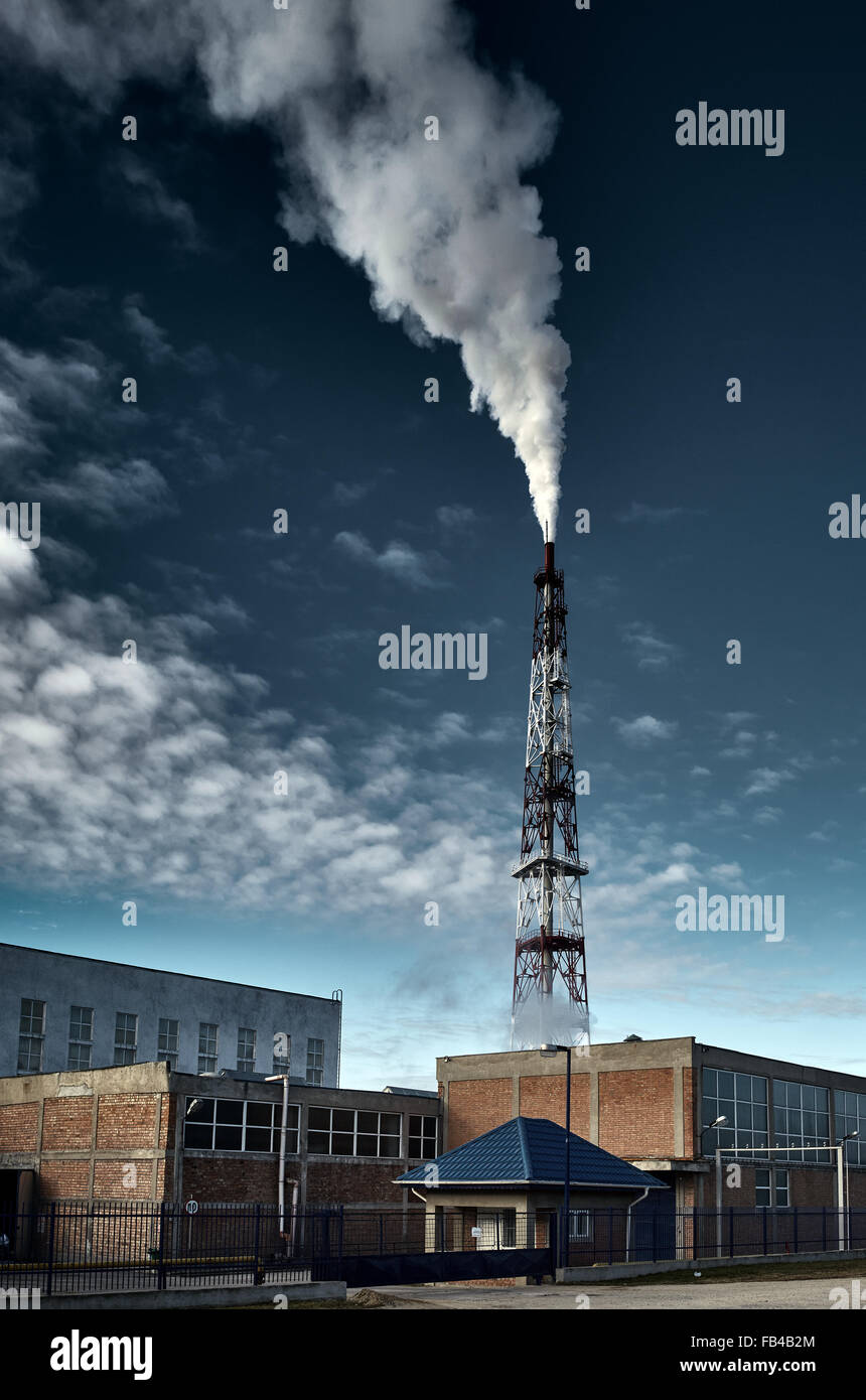Industrial facility with a furnace throwing polluting smoke Stock Photo ...