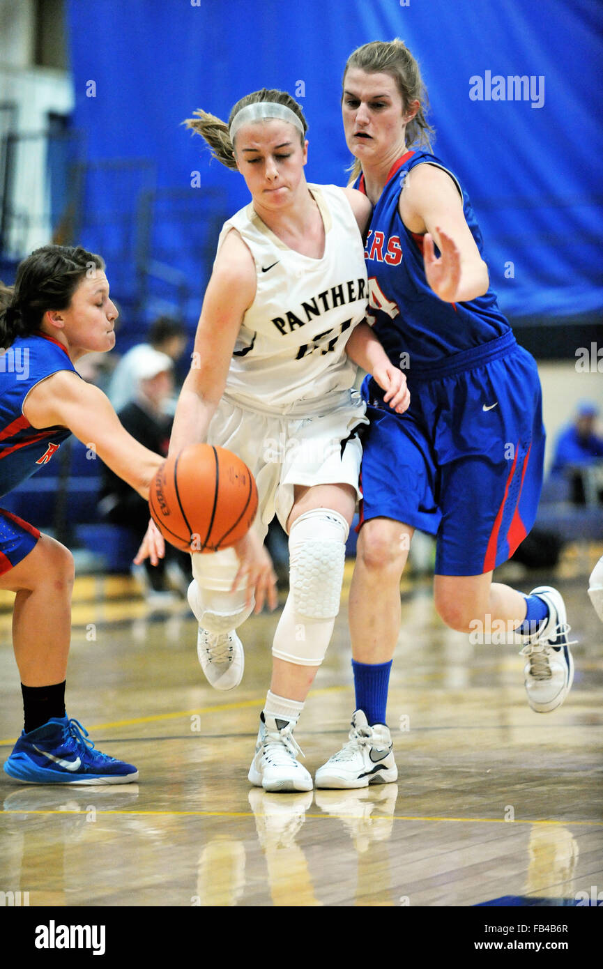 Player splitting the defense while driving on the basket during a high ...