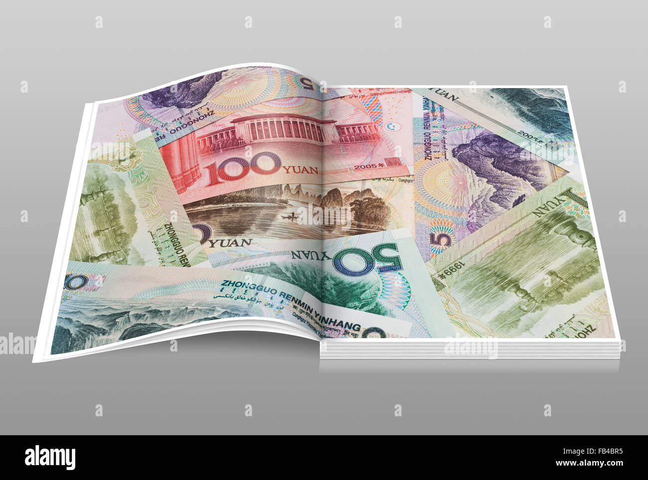 Many Yuan bills lying side by side. The renminbi, the Chinese currency ...