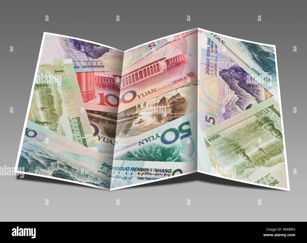 Many Yuan bills lying side by side. The renminbi, the Chinese currency ...