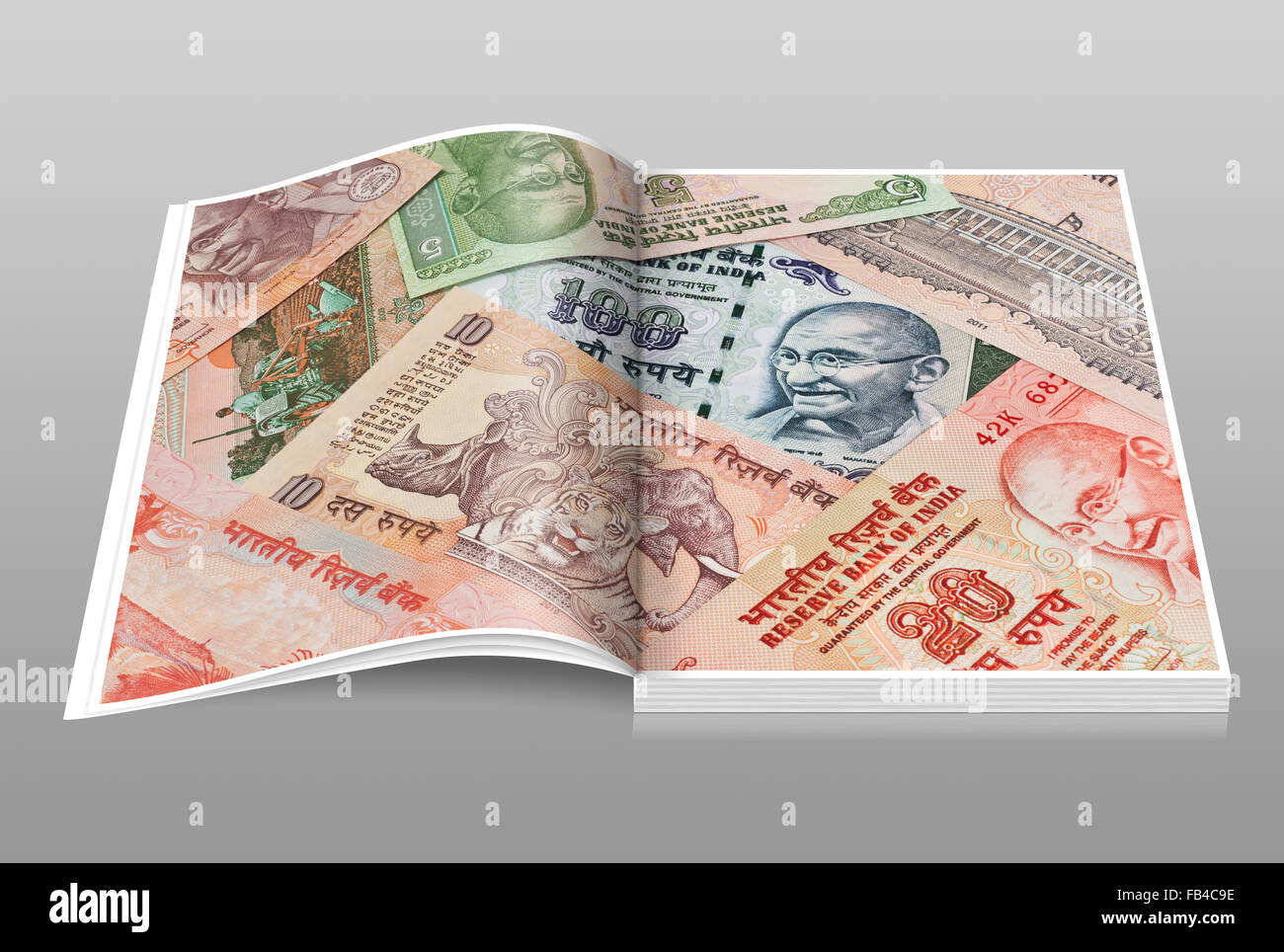 Many Indian rupees bills with the portrait of Mahatma Gandhi lying side ...