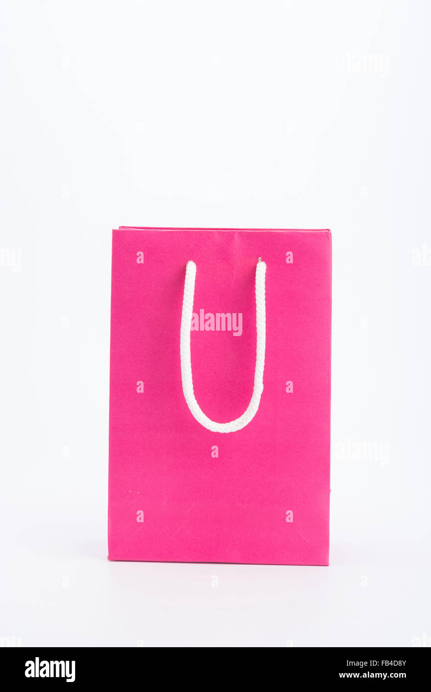 Pink shopping bag on a white background Stock Photo - Alamy