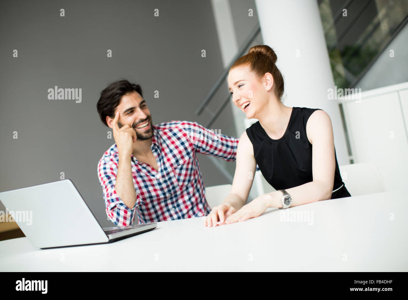 Young people in the office Stock Photo - Alamy