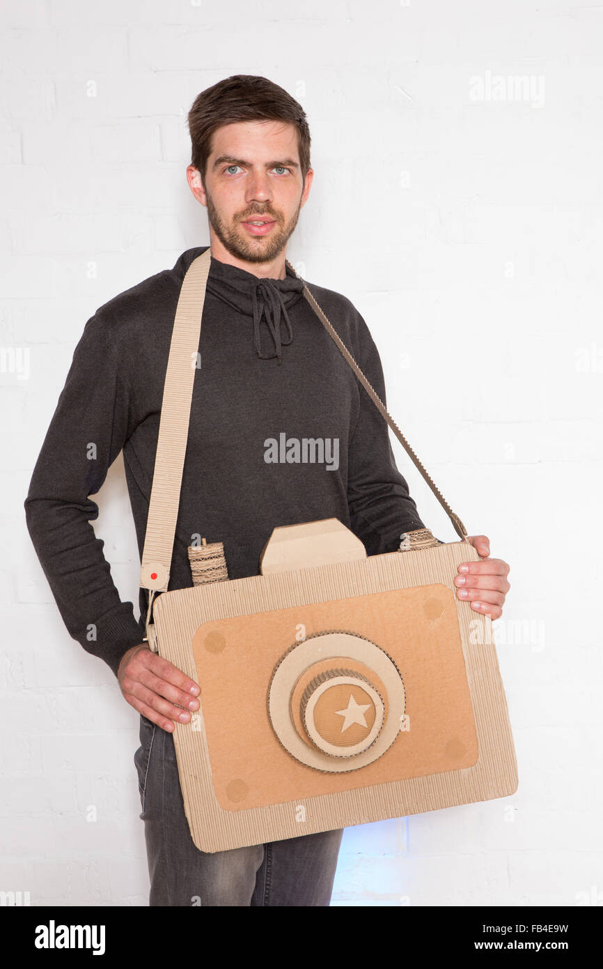 cheerful man with a handmade cardboard camera Stock Photo - Alamy