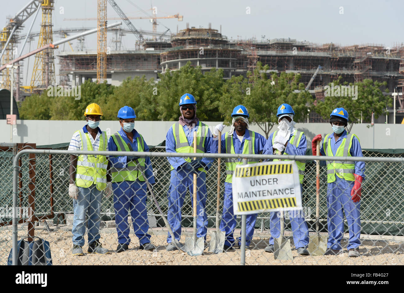 Construction workers from Sri Lanka pose for a photo at a construction ...