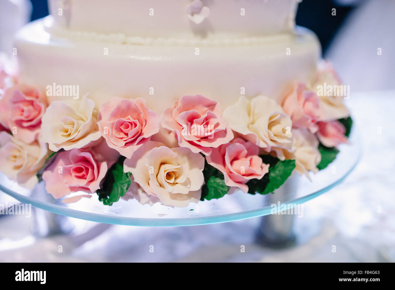 wedding cake decorated with roses Stock Photo - Alamy