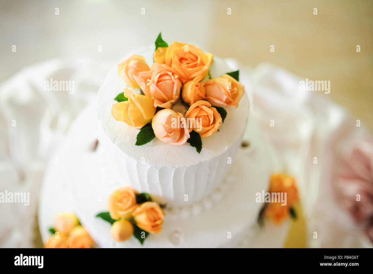wedding cake decorated with roses Stock Photo - Alamy