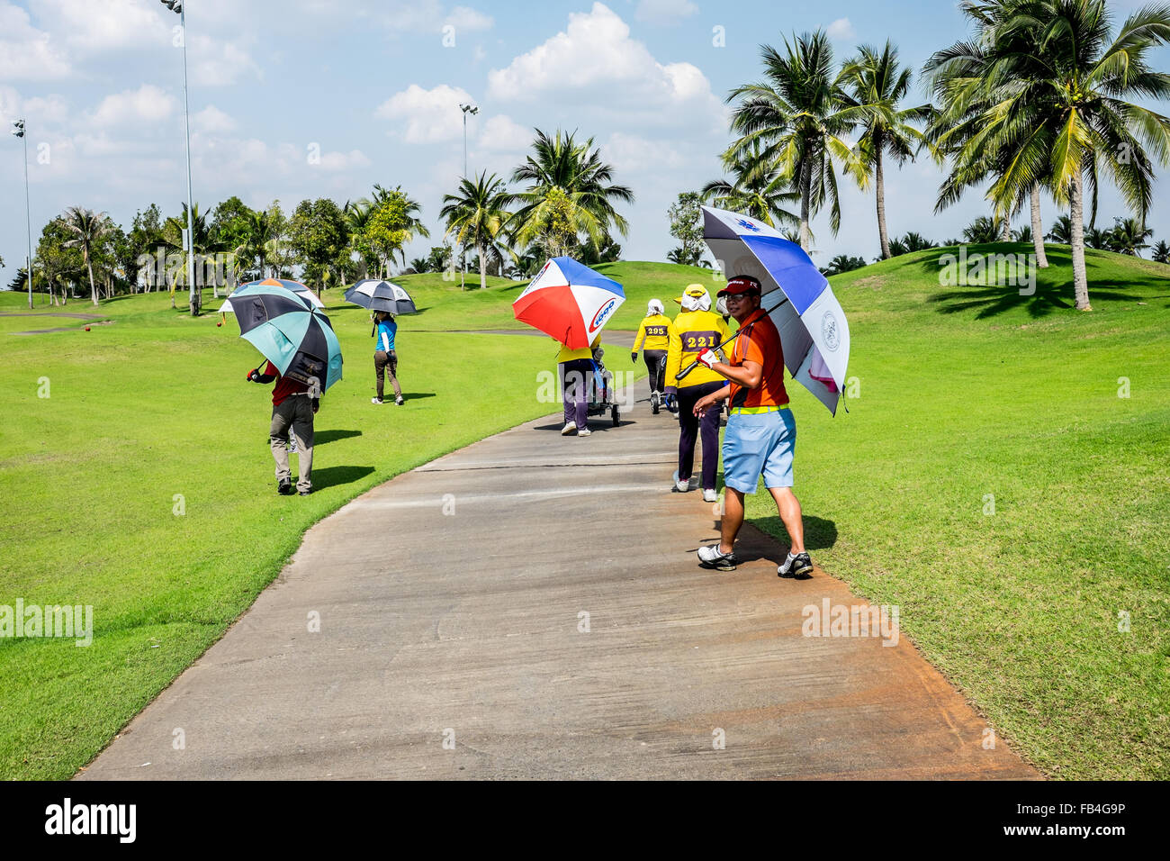 Golfers with caddies hi-res stock photography and images - Alamy