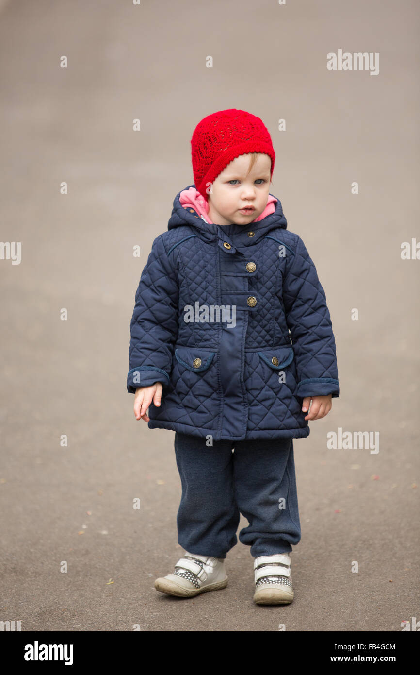 little girl on a park alley in spring Stock Photo - Alamy