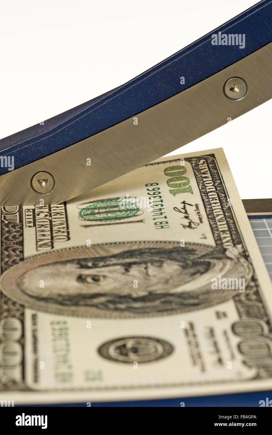 Paper Cutter Cutting a One Hundred Dollar Bill Stock Photo - Alamy