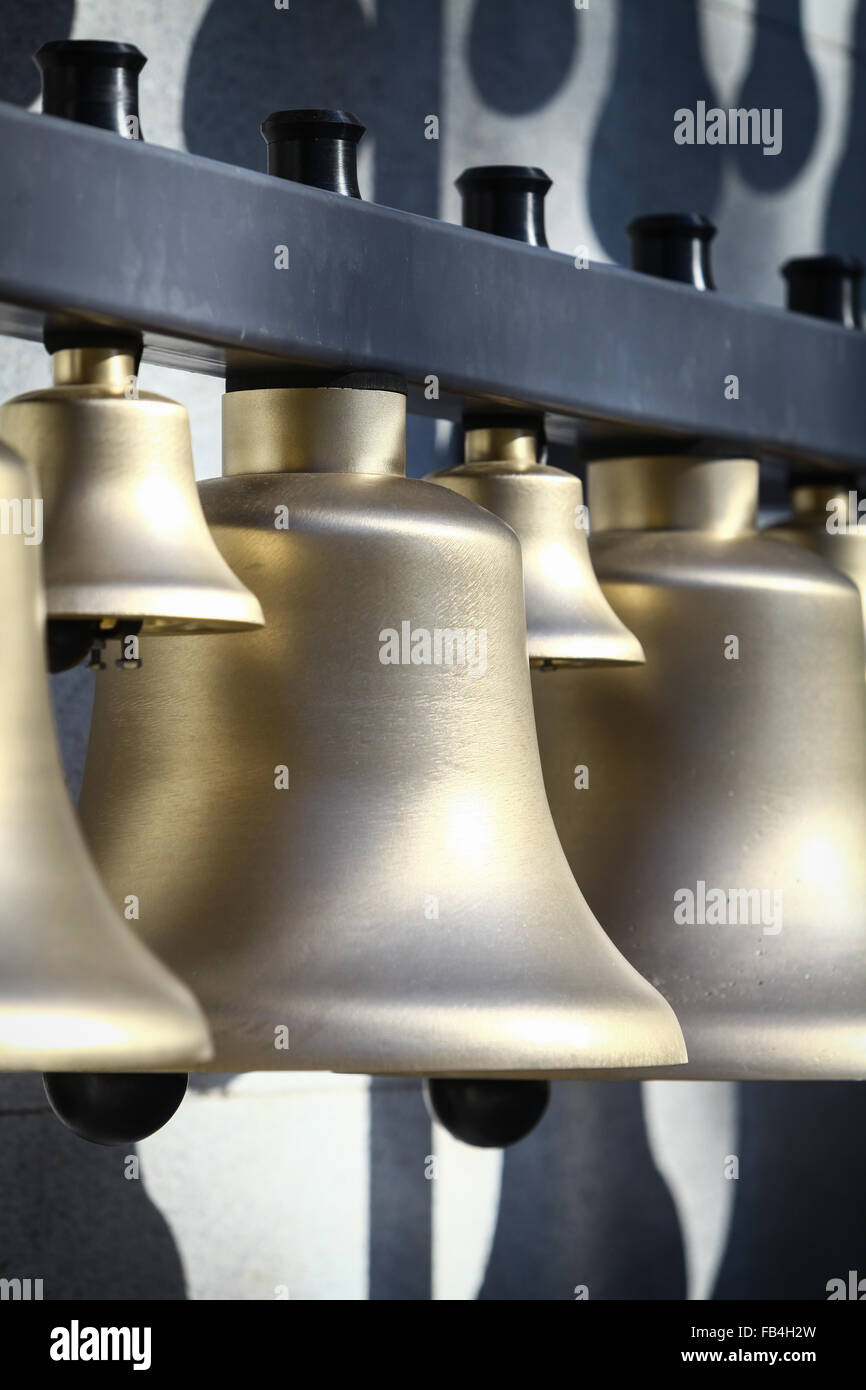 Color image of some various sized bells in a row Stock Photo - Alamy