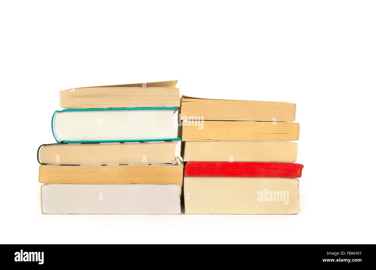 Two piles of books, isolated over white background Stock Photo - Alamy