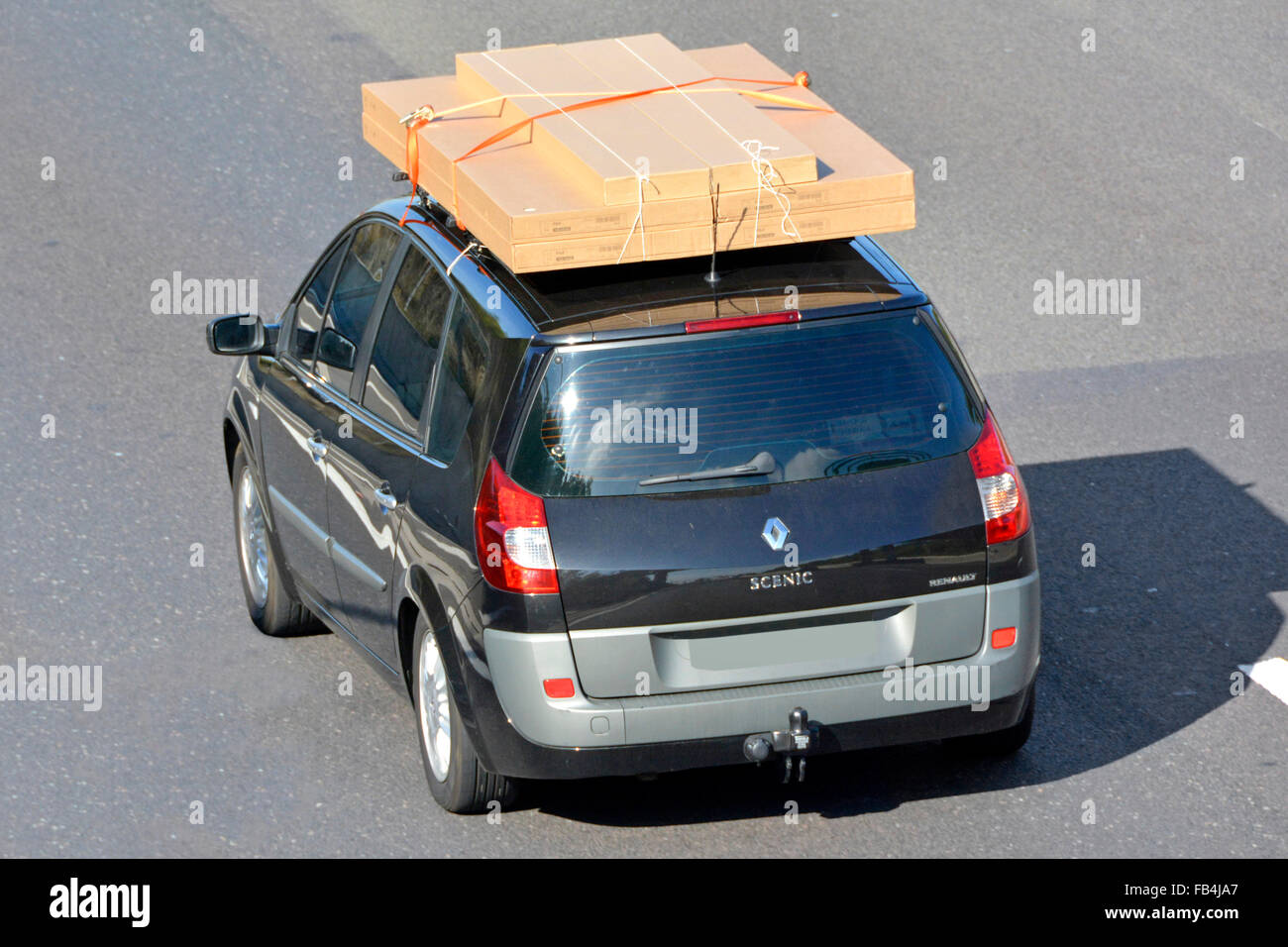 Driving car loaded with boxes High Resolution Stock Photography and ...