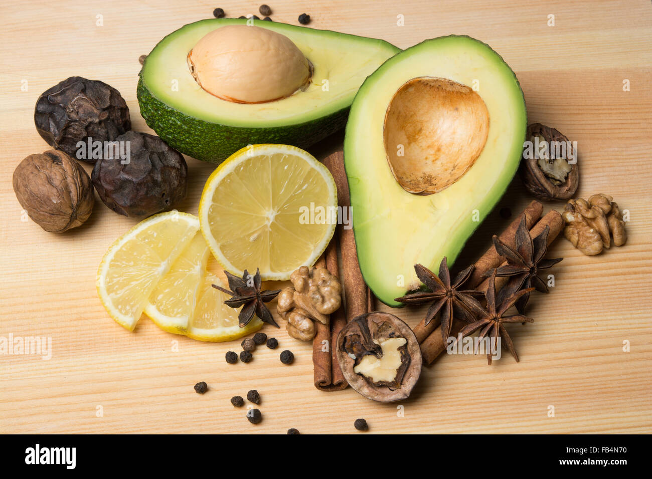 avocado with juicy lemon and natural nuts Stock Photo - Alamy