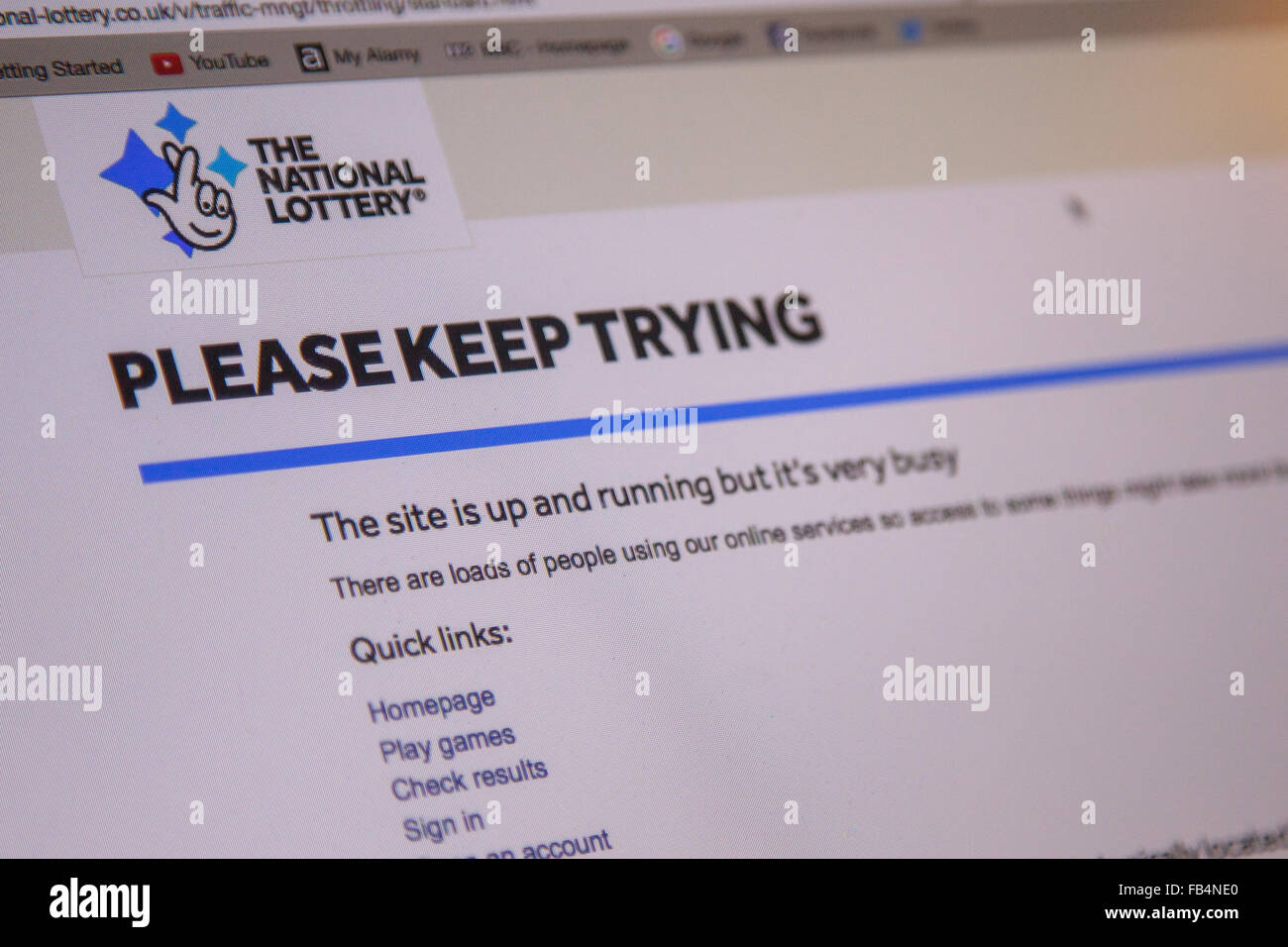 The National Lottery website appearing on a laptop screen showing that ...