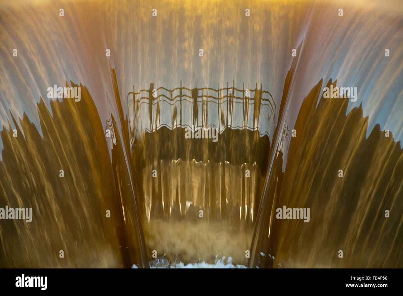 waterfall over man made obstacle Stock Photo - Alamy