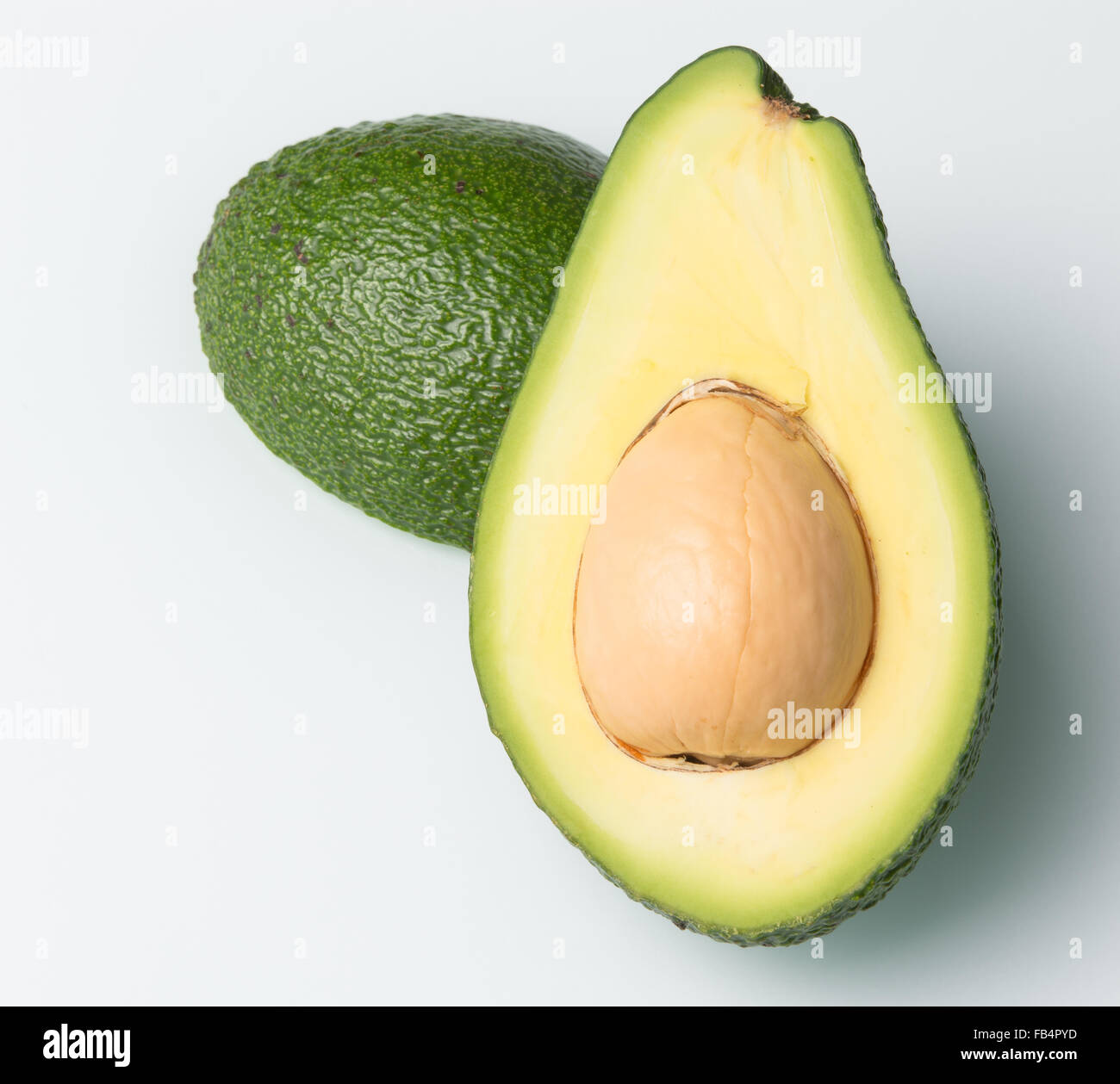 cut in half avocado Stock Photo - Alamy