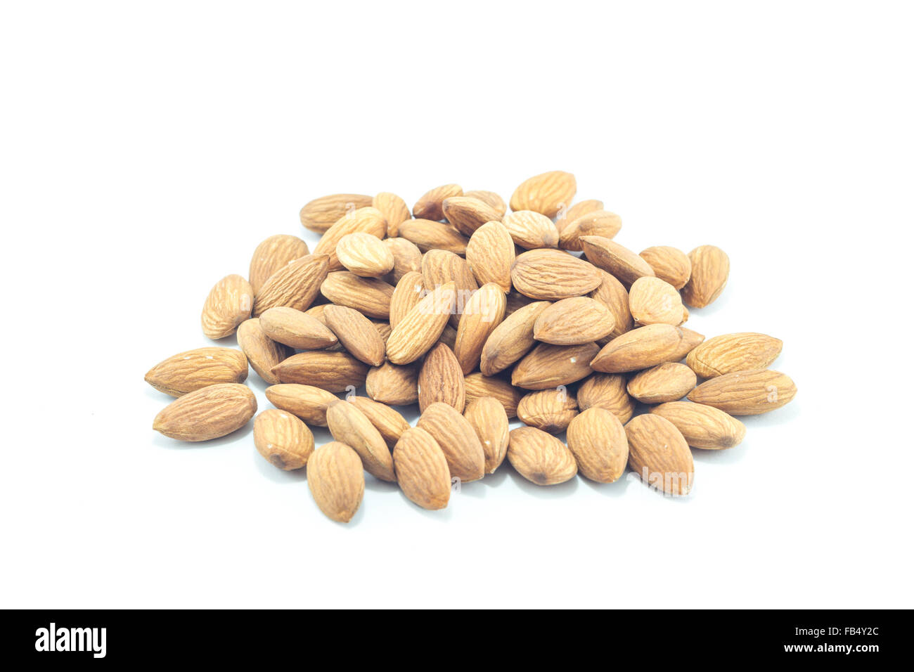 Almond seeds isolated on white background Stock Photo - Alamy
