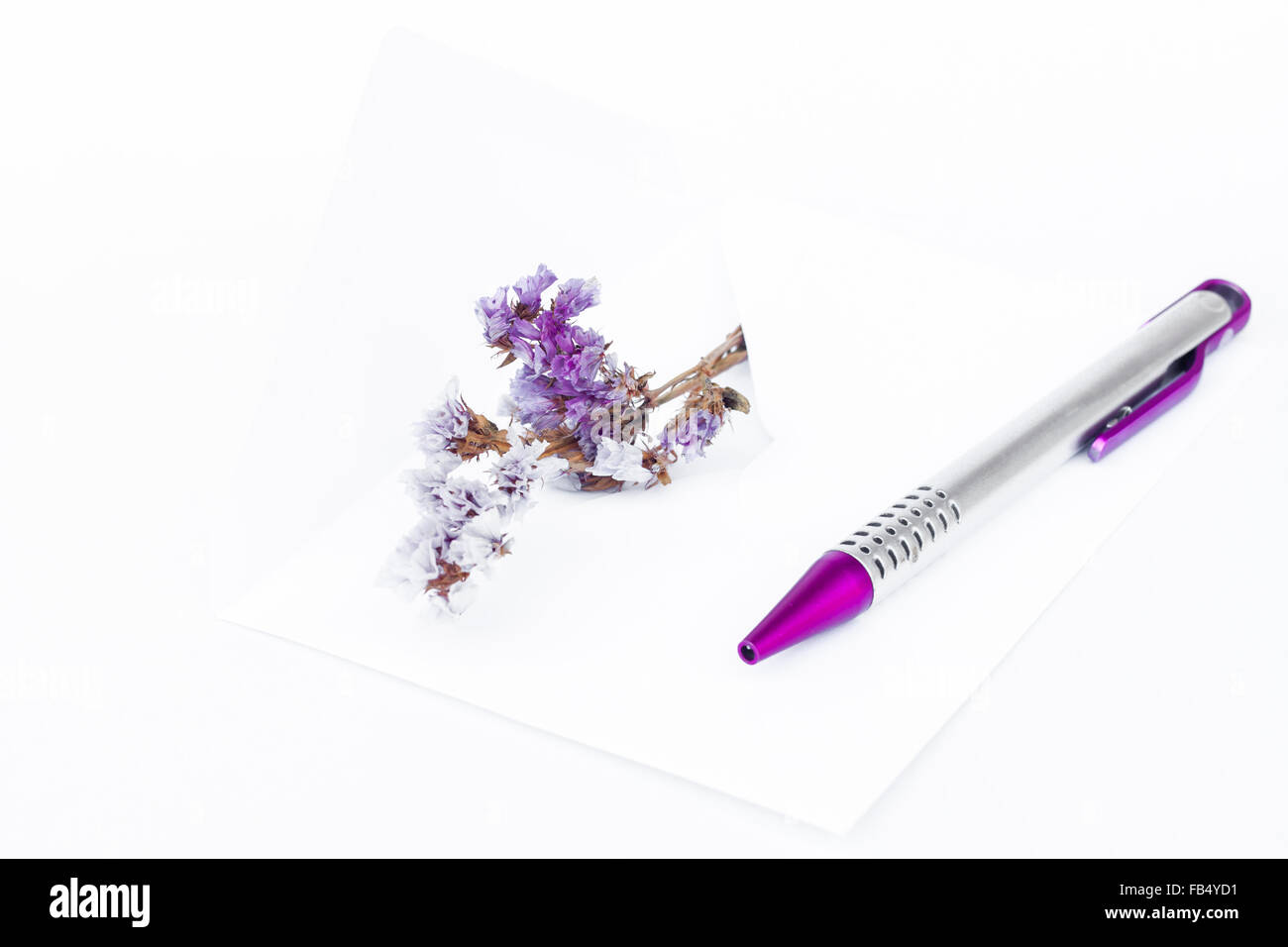 Envelope with pen isolated on white background, stock photo Stock Photo ...