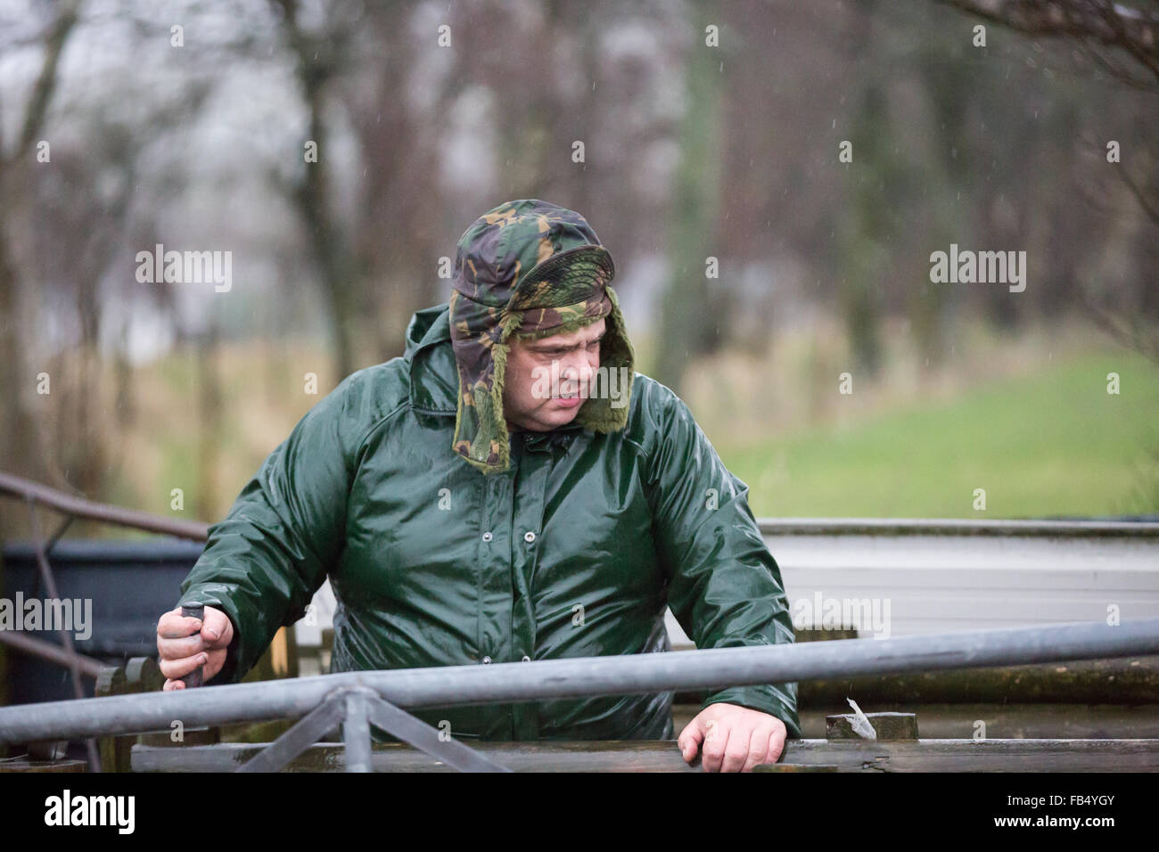 farmer working in the rain Stock Photo - Alamy