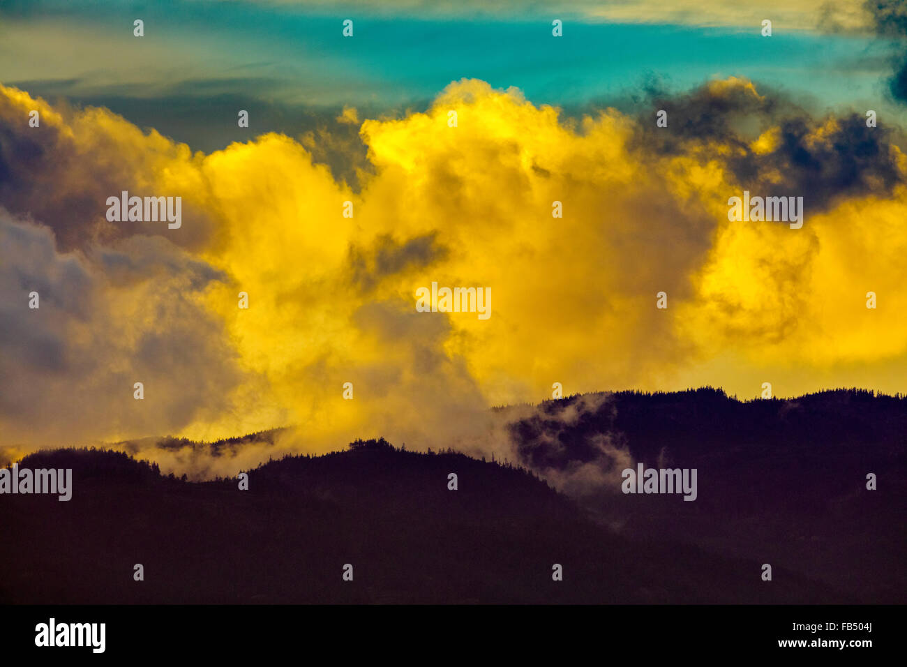Sunset through dramatic clouds on Vancouver Island, British Columbia ...