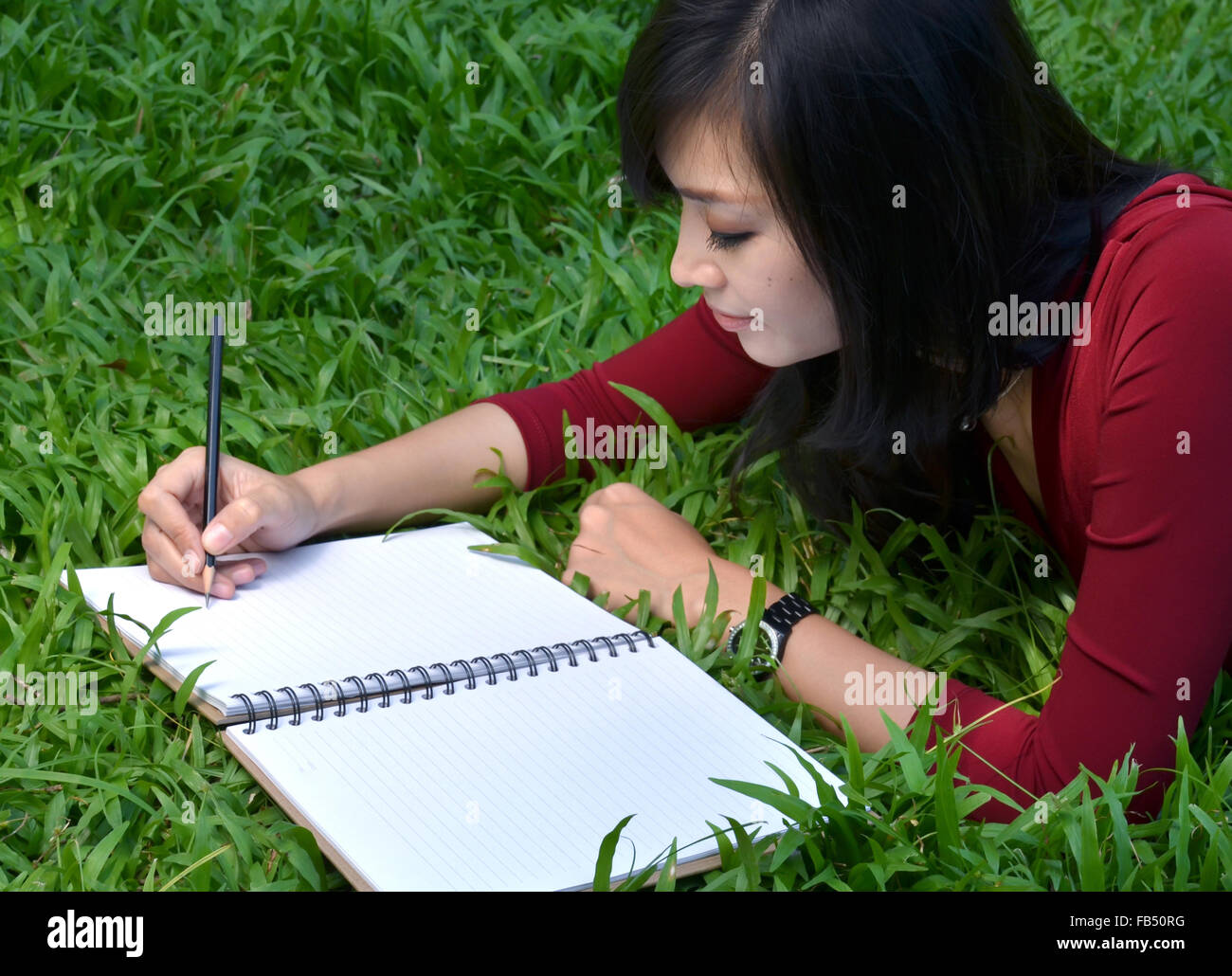 Girl teenager writing grass hi-res stock photography and images - Alamy