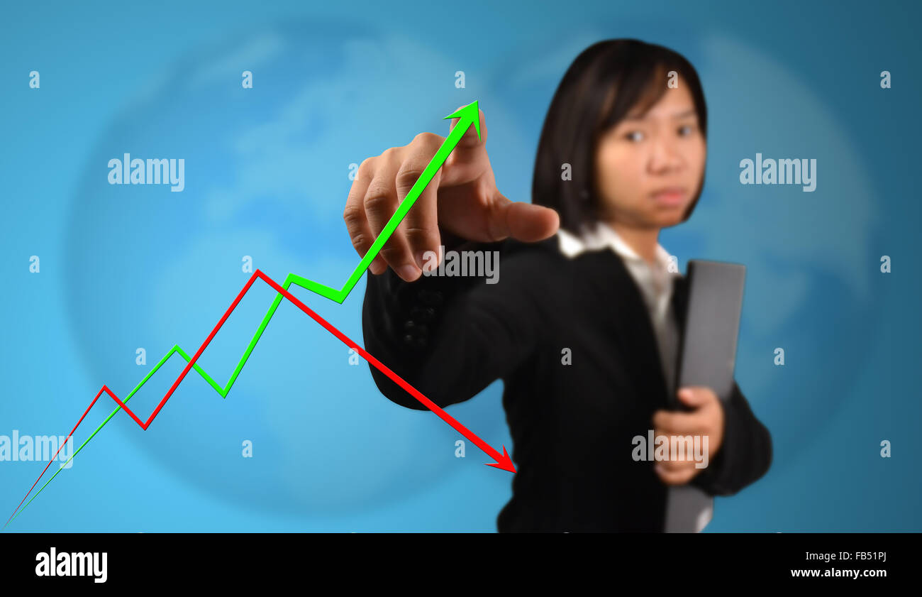 working women write a business graph Stock Photo - Alamy