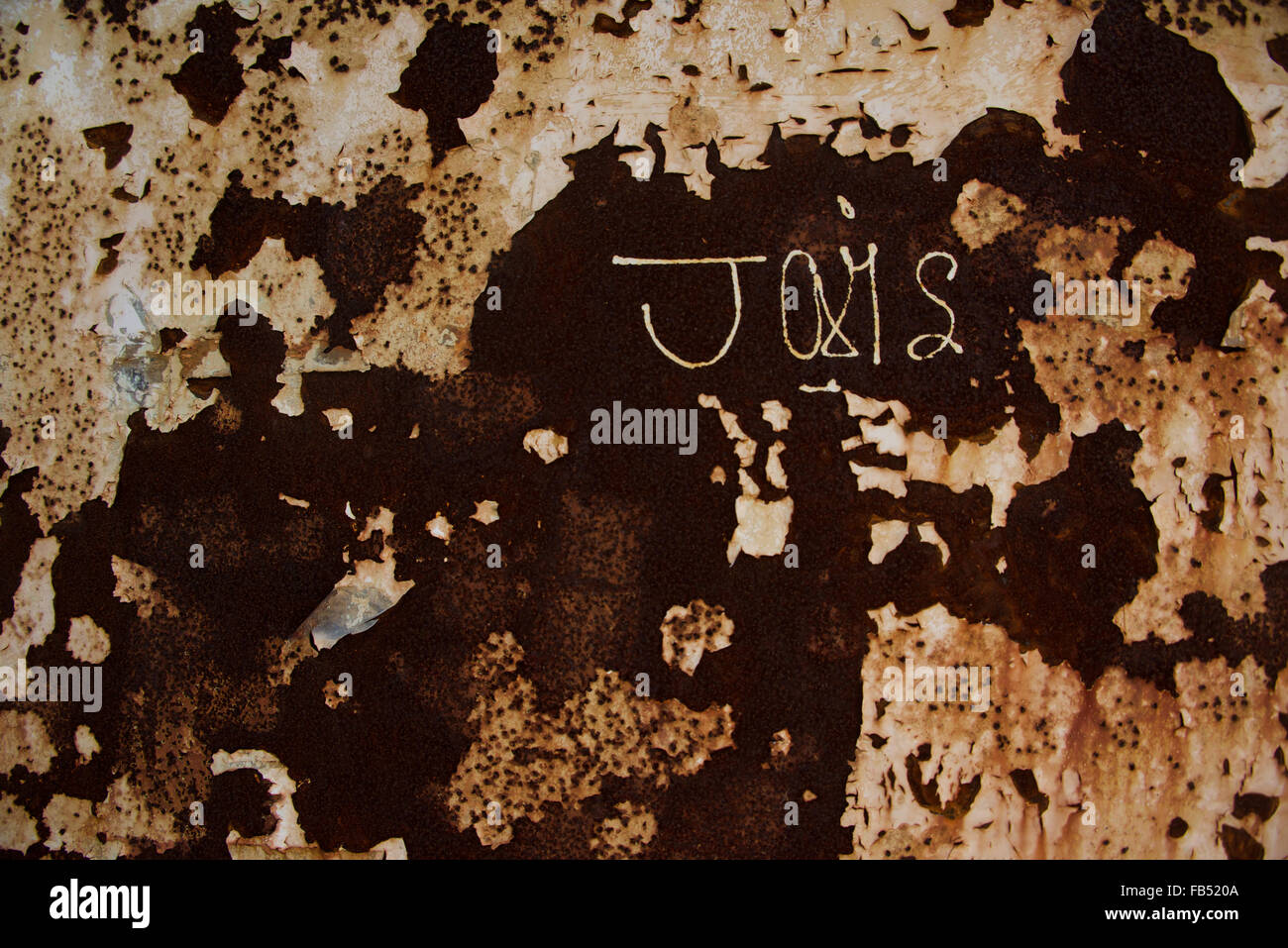 Rusty sign with graffiti signature at top Stock Photo - Alamy