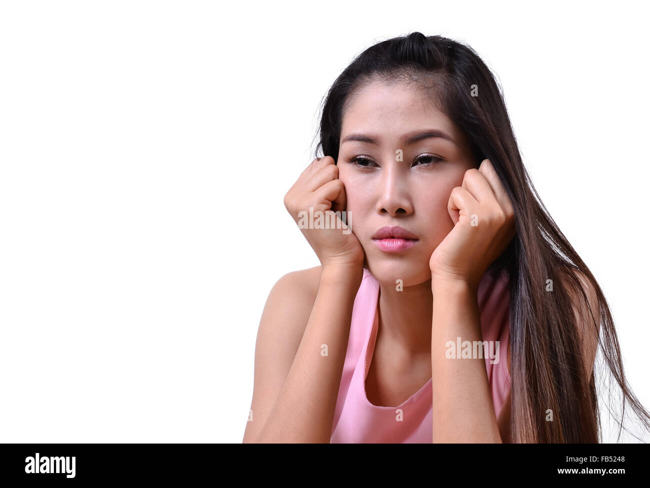 Sad beautiful woman standing against a white background Stock Photo - Alamy
