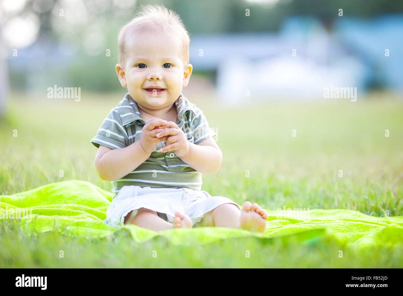 Happy small boy outdoors in a park Stock Photo - Alamy