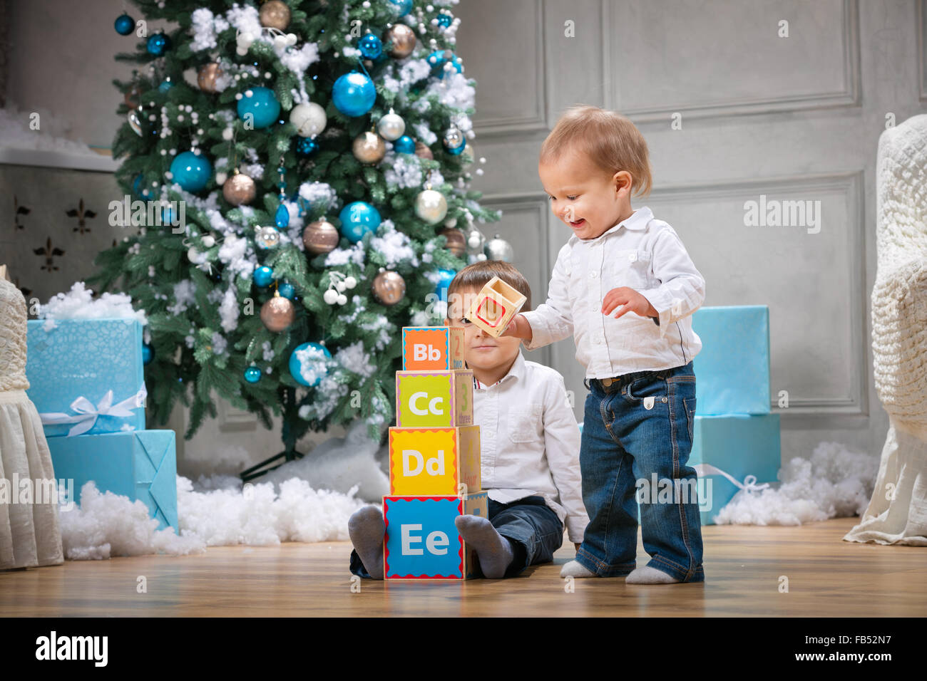 Child playing with letter blocks hi-res stock photography and images ...