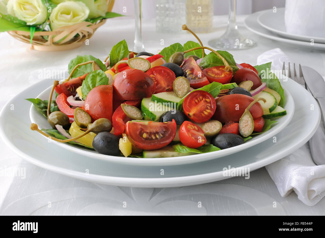Salad of summer vegetables with basil and capers Stock Photo - Alamy