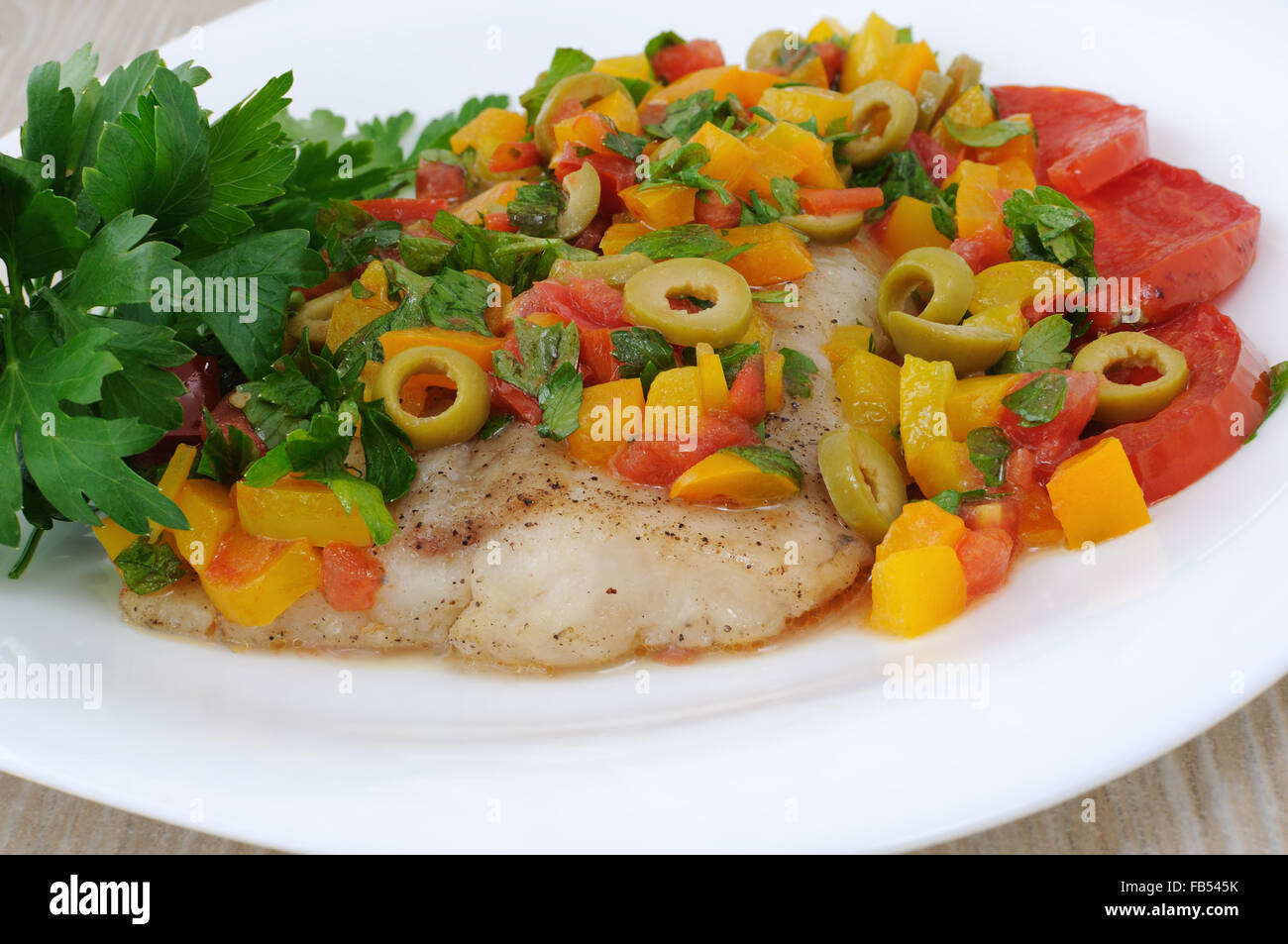 piece of juicy filet of fish with steamed vegetables Stock Photo - Alamy