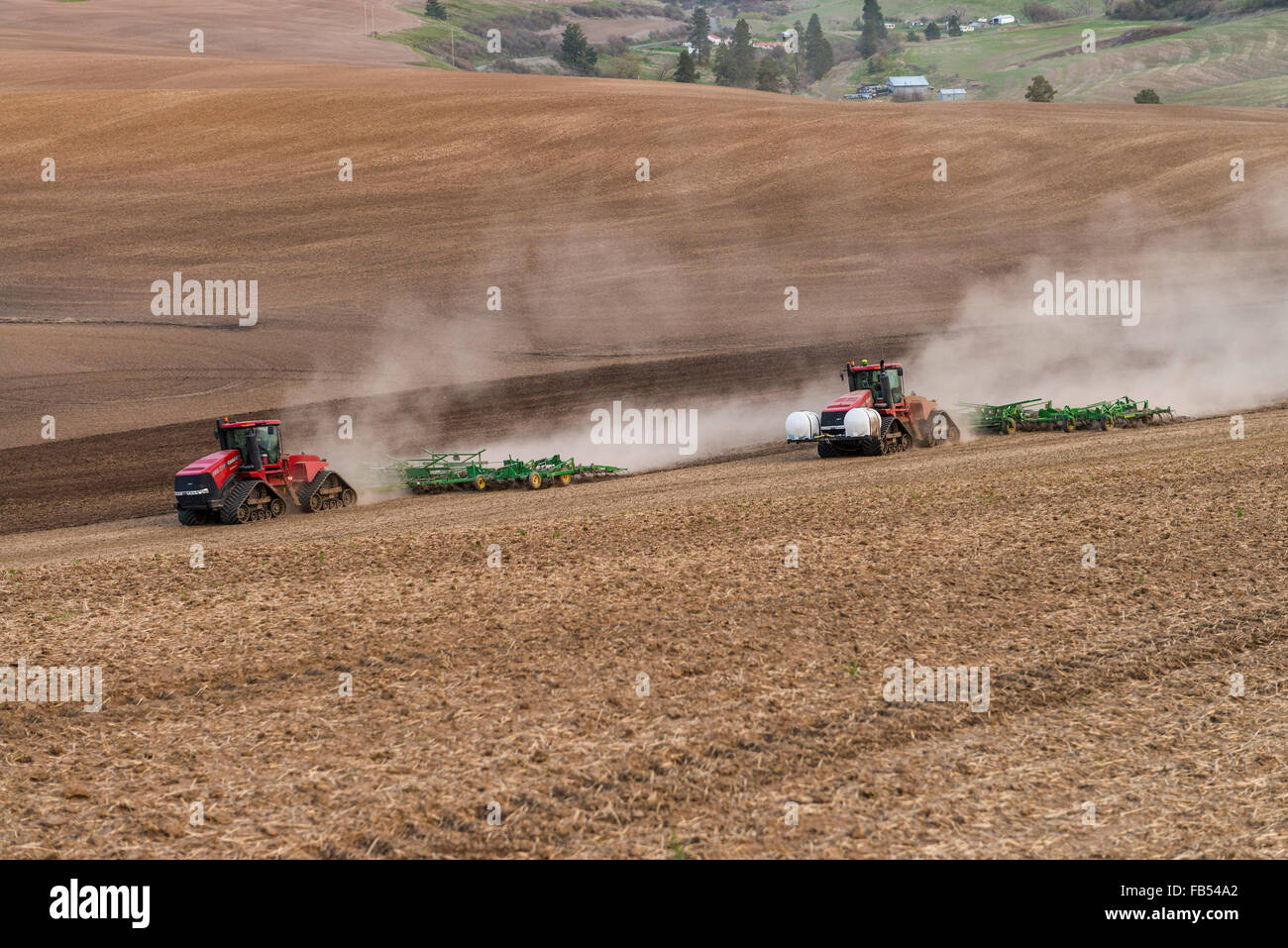 Case track tractor tilling a field with a cultivator in the Palouse ...