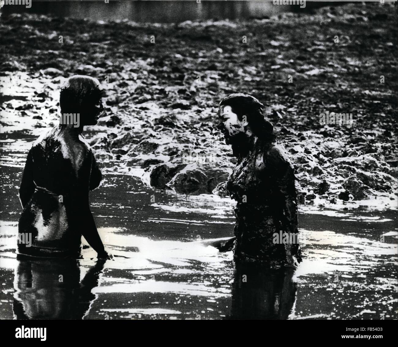 1974 - Australia Mud cased figures larking around in a Sydney mud pool ...