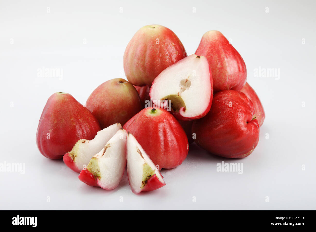 The red Java apples on the plain background Stock Photo - Alamy