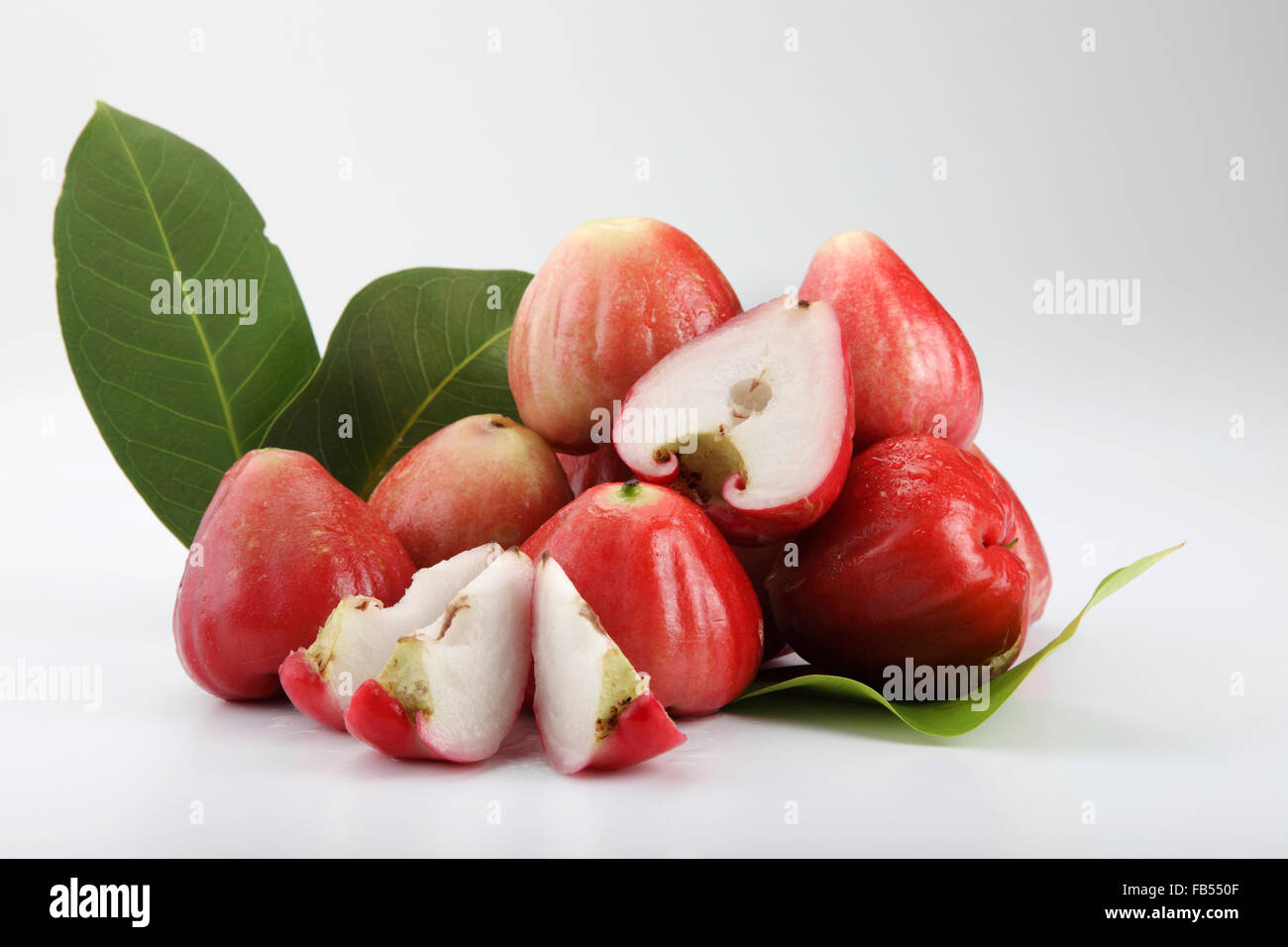 The red Java apples on the plain background Stock Photo - Alamy