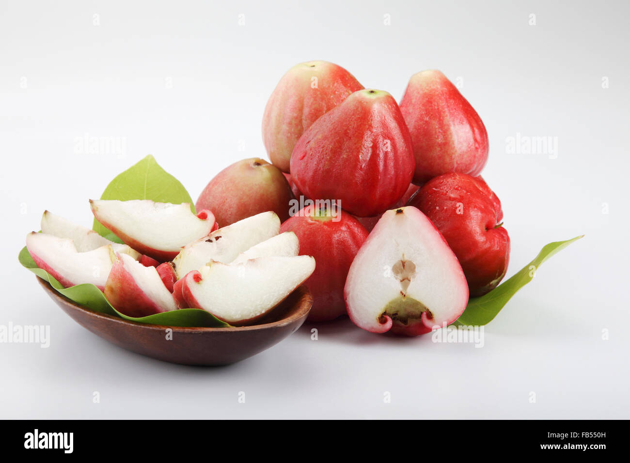The red Java apples on the plain background Stock Photo - Alamy