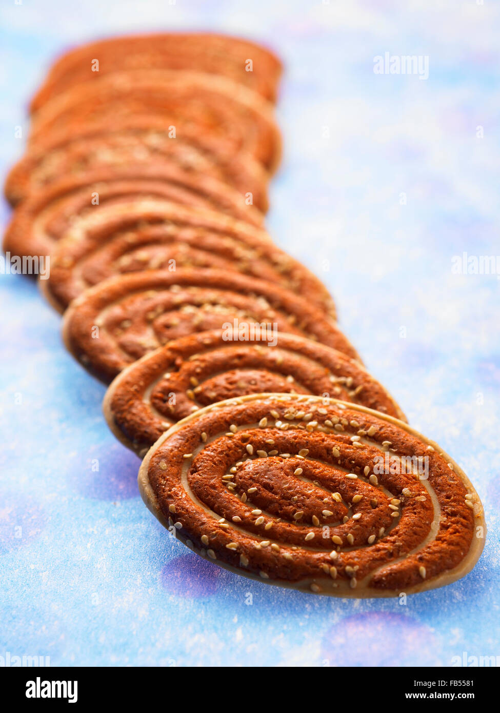 ear shape of cookies on the blue background Stock Photo - Alamy