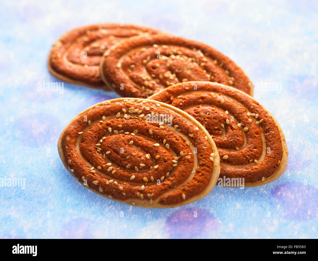 ear shape of cookies on the blue background Stock Photo - Alamy