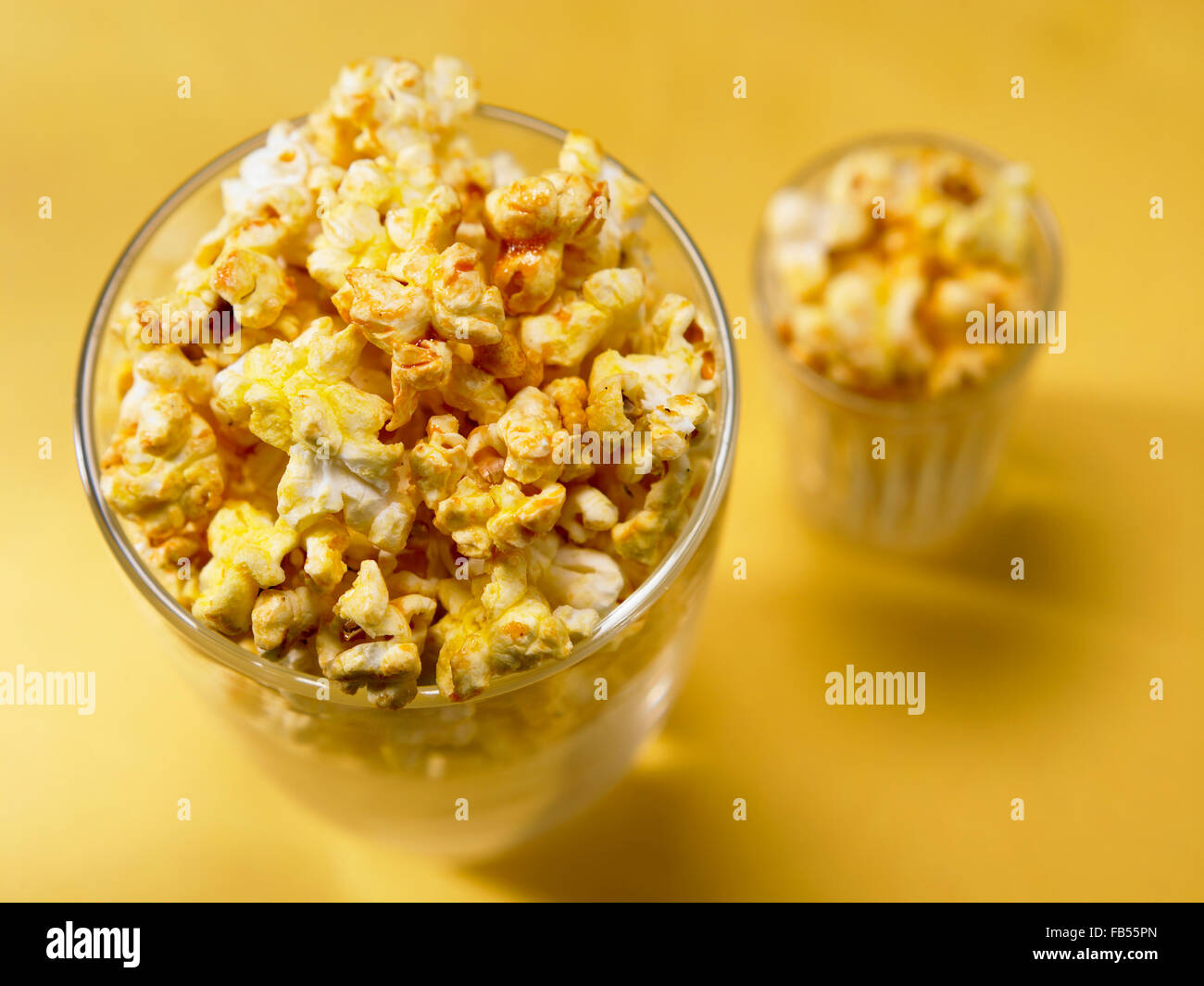 two difference size of popcorn side by side Stock Photo - Alamy