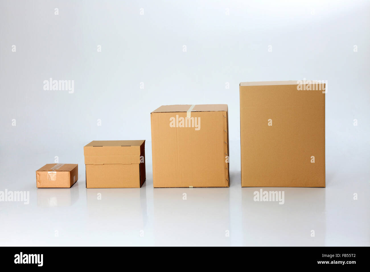 four difference size of box in a line Stock Photo - Alamy