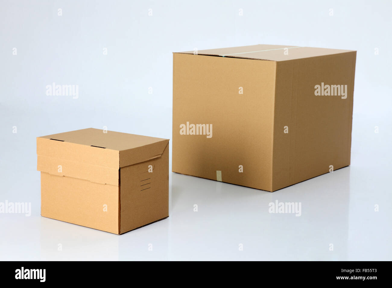 two difference size of box side by size Stock Photo - Alamy