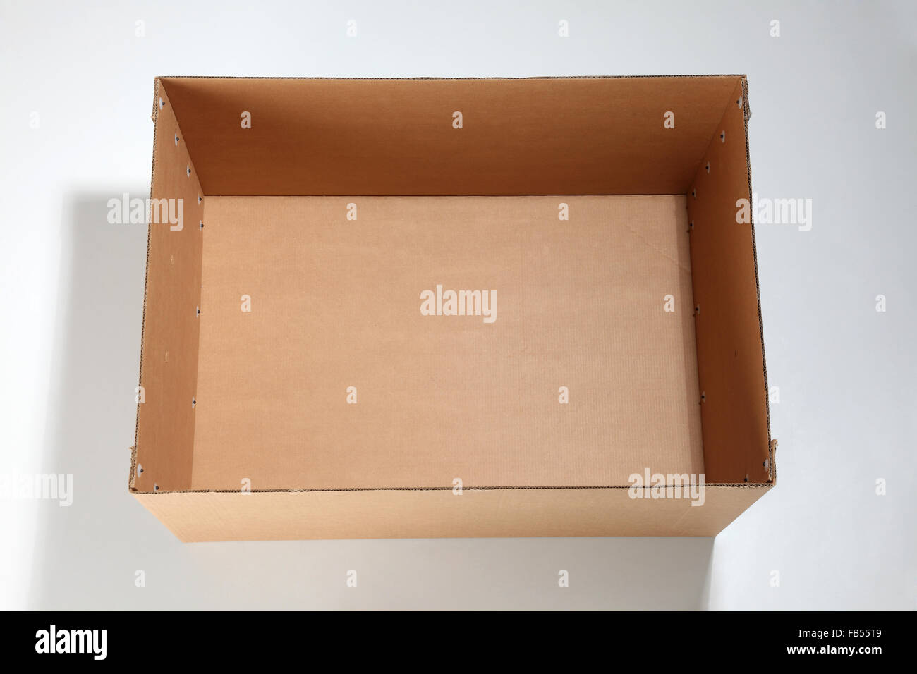 empty brown cardbox open on the plain background Stock Photo - Alamy